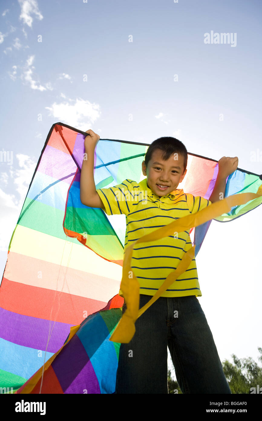 Portrait of young boy with kite Stock Photo - Alamy