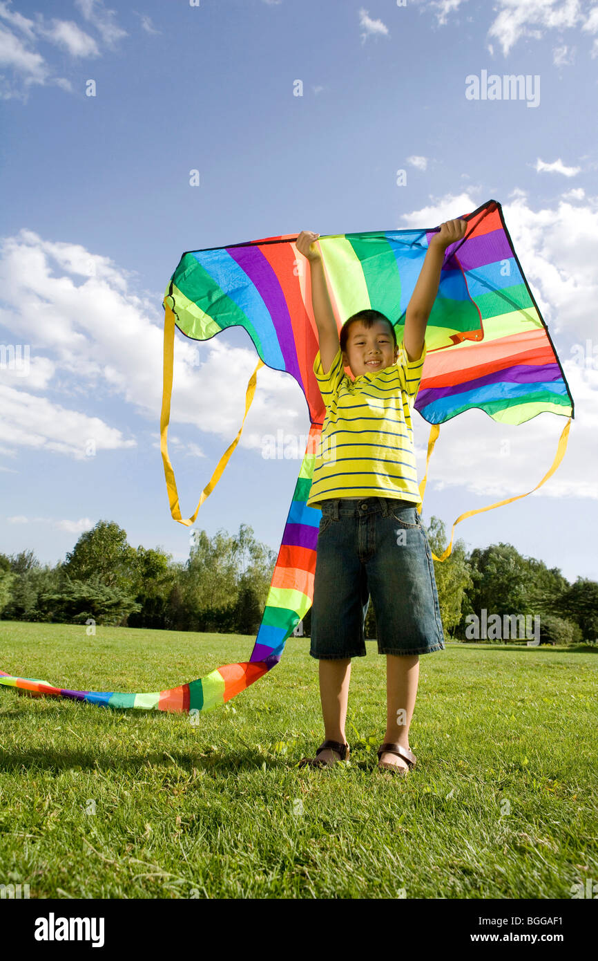Portrait of young boy with kite Stock Photo - Alamy