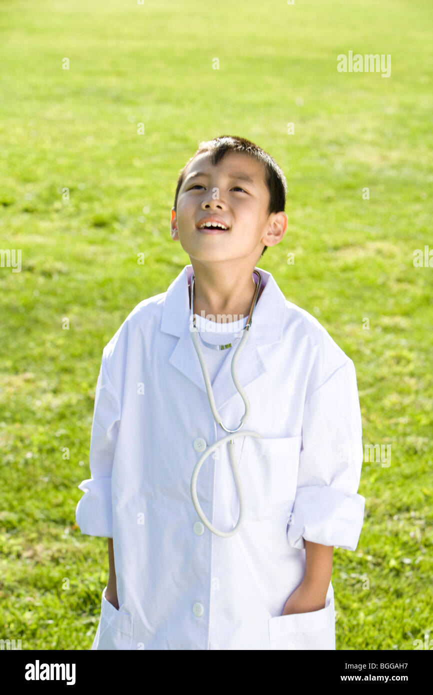 Young boy playing doctor Stock Photo - Alamy