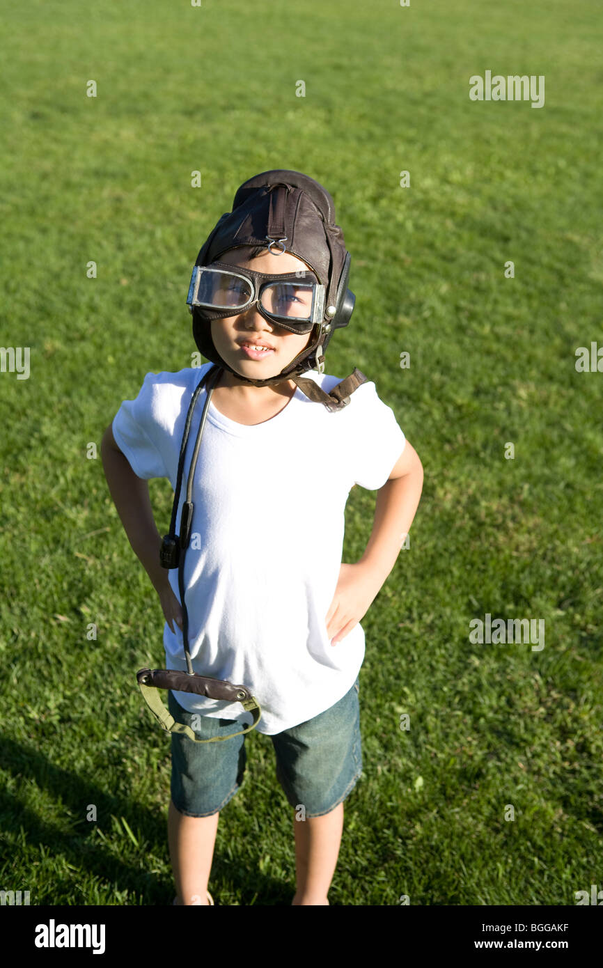 Young boy playing airplane pilot Stock Photo - Alamy