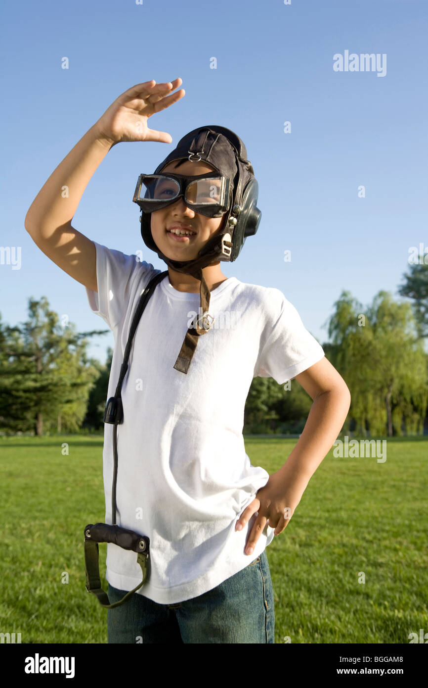 Young boy playing airplane pilot Stock Photo - Alamy