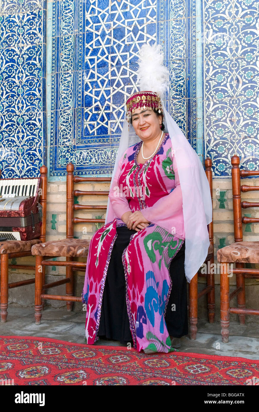 Woman in traditional dress, Tosh Hovli Palace, Khiva, Uzbekistan Stock ...