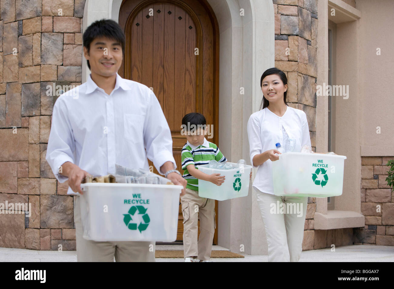 Family doing recycling Stock Photo - Alamy