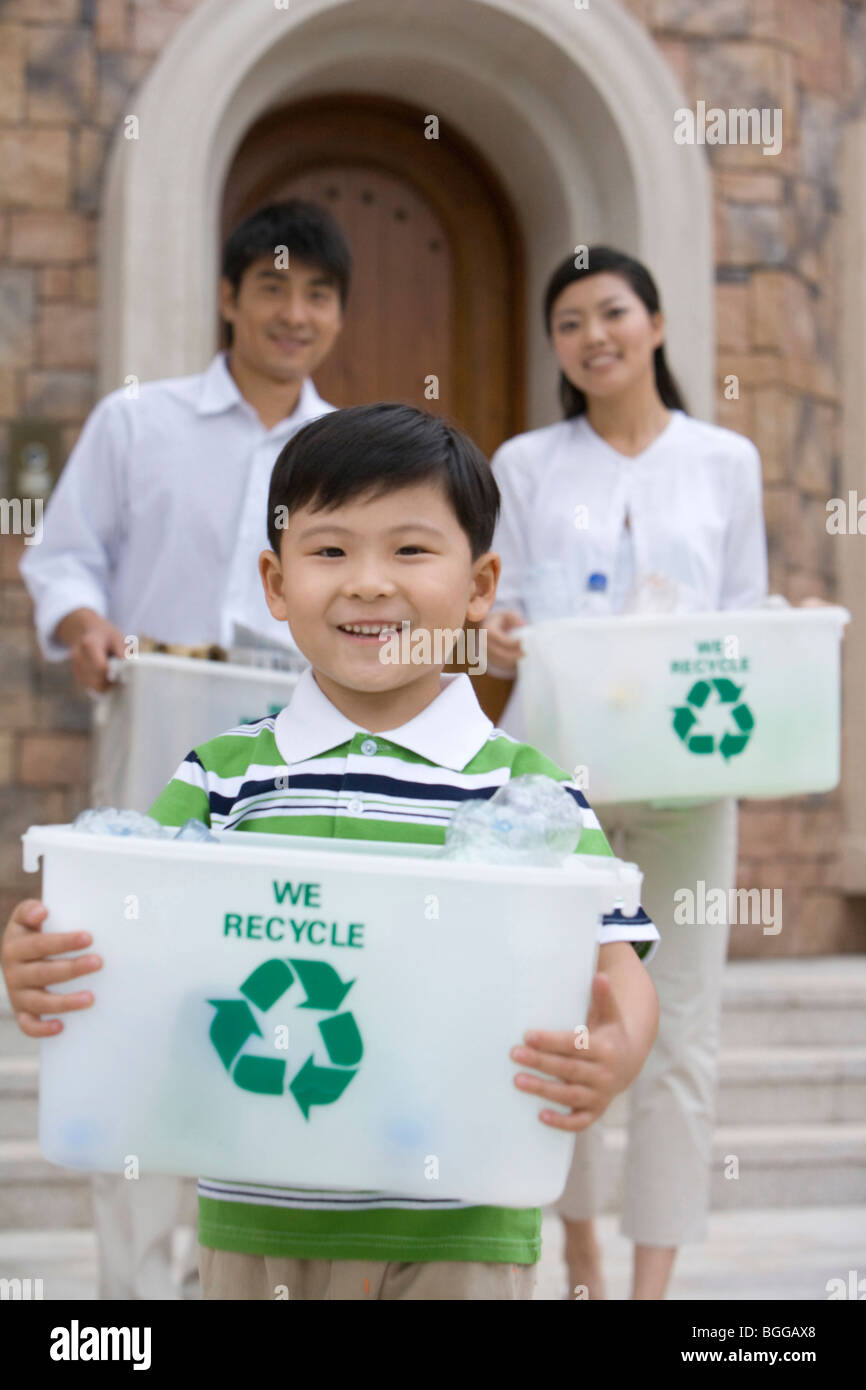 Family doing recycling Stock Photo - Alamy