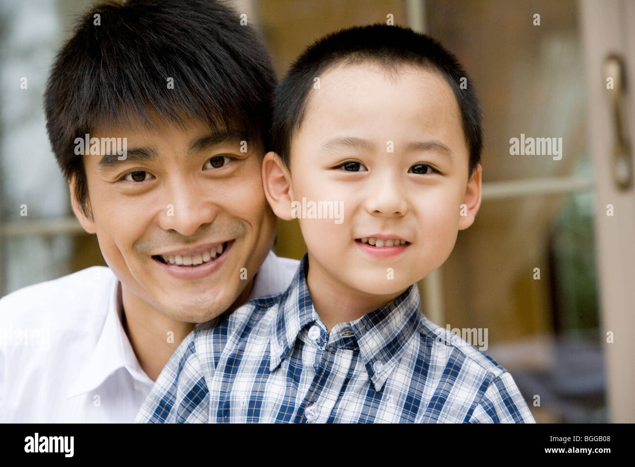 Portrait of father and son Stock Photo - Alamy