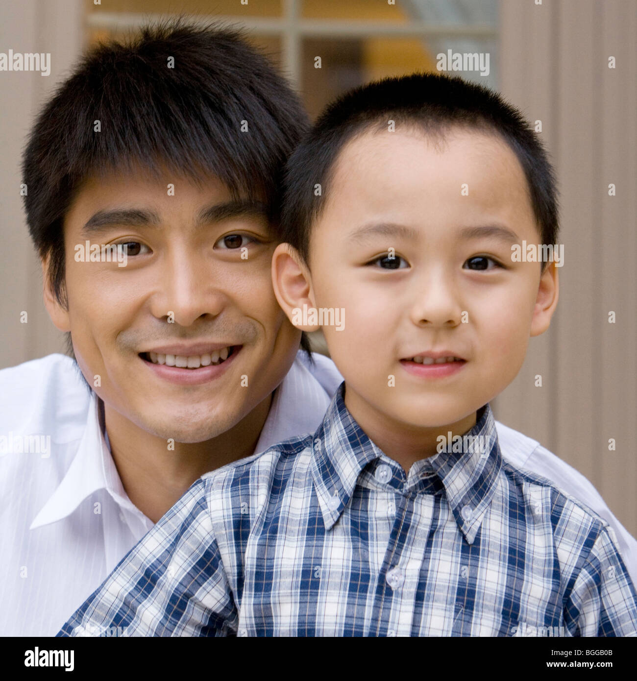 Portrait of father and son Stock Photo - Alamy