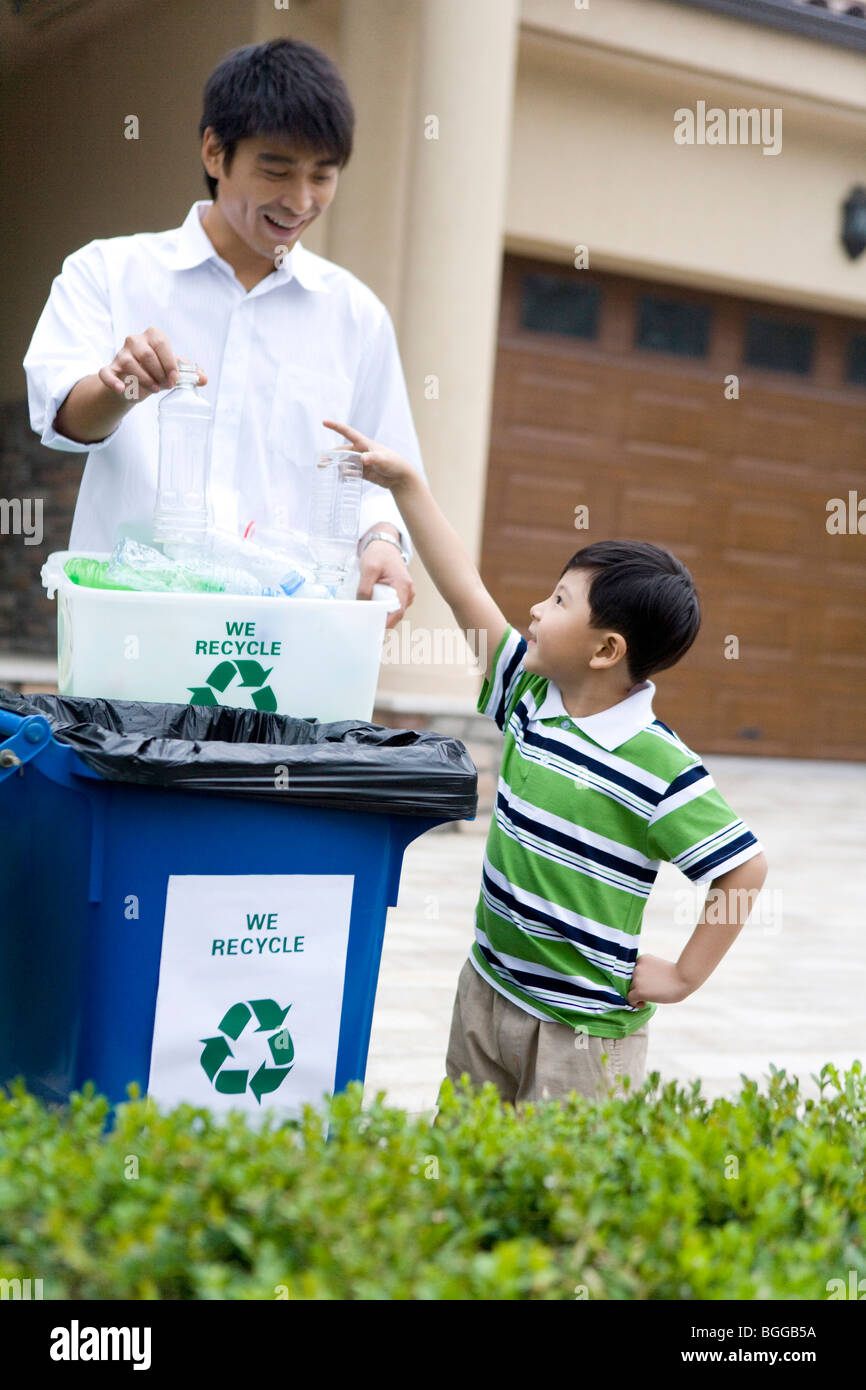 Father and son doing recycling Stock Photo - Alamy