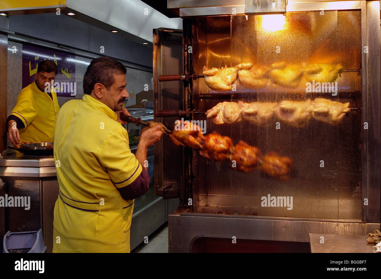 Man roasting chickens in rotisserie in Tripoli, Lebanon Stock Photo - Alamy