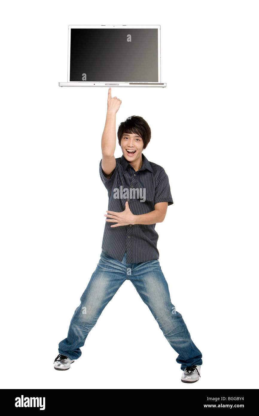 Young man with laptop Stock Photo - Alamy