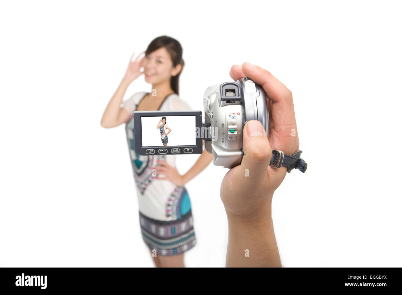 Young woman posing for digital camera Stock Photo - Alamy