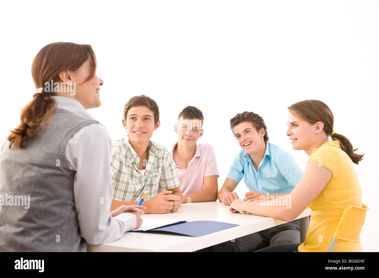 Students listening a teacher Stock Photo - Alamy
