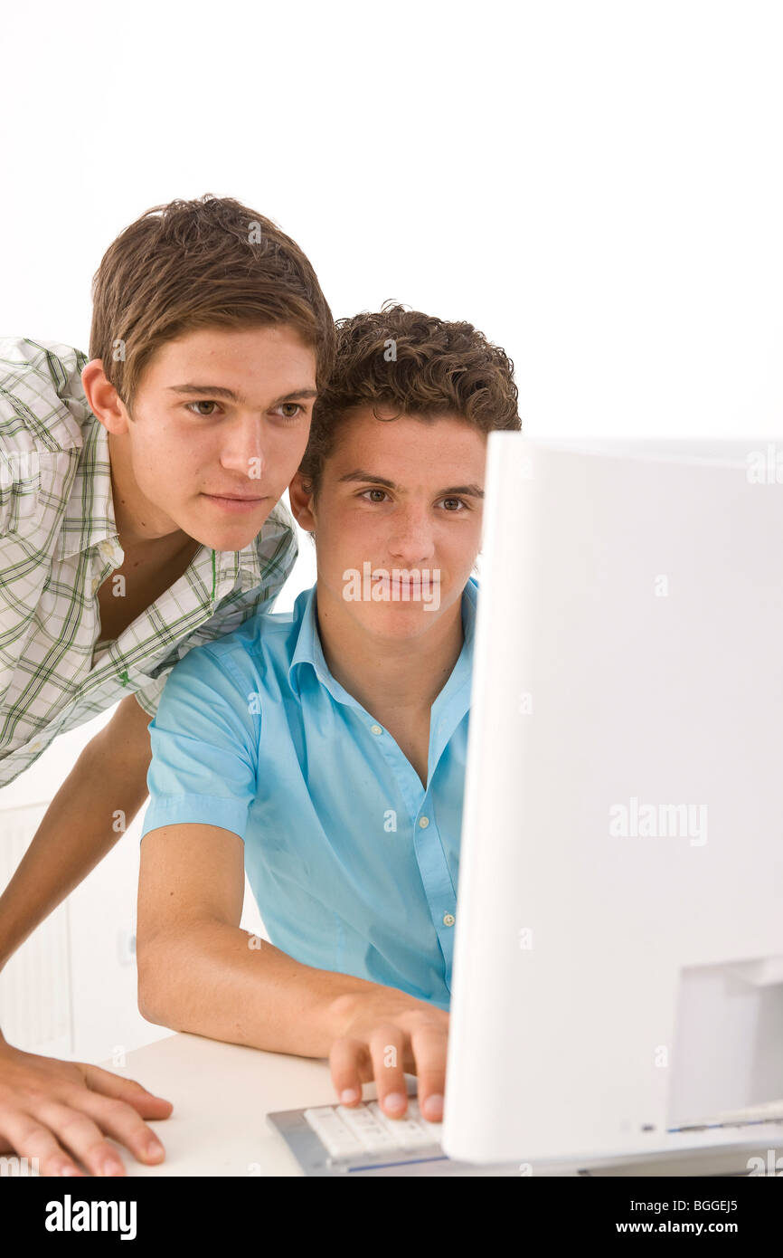 two boys in front of a computer Stock Photo - Alamy