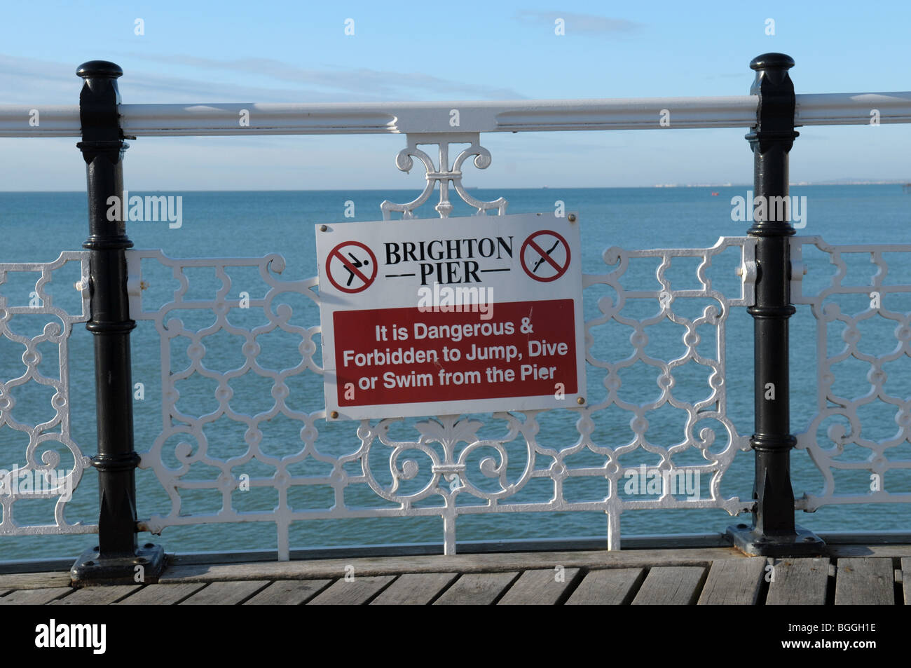 Warning sign on Brighton Pier Stock Photo - Alamy