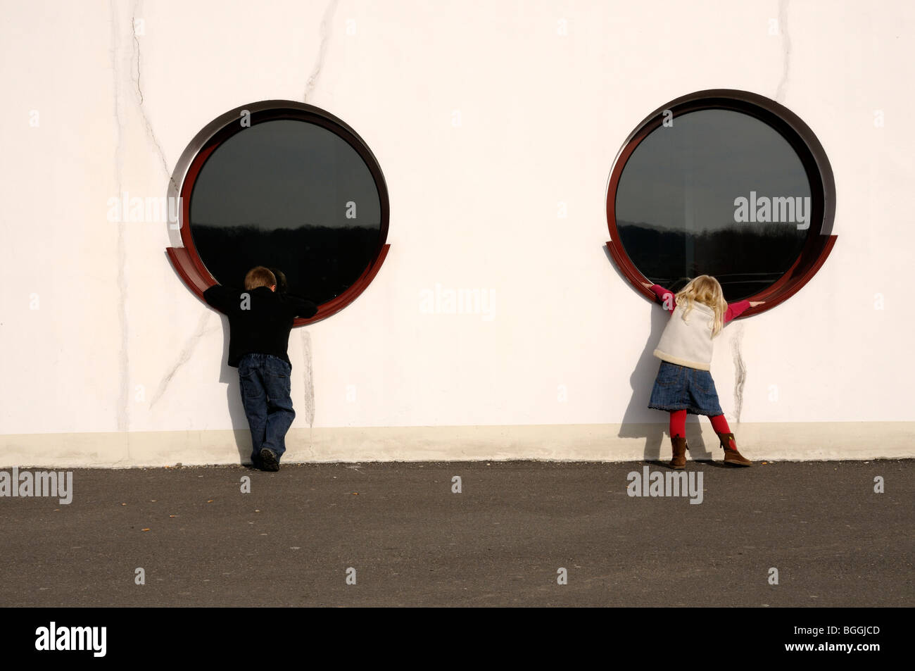 Stock photo of a 3 year old girl and her 9 year old brother peeking ...