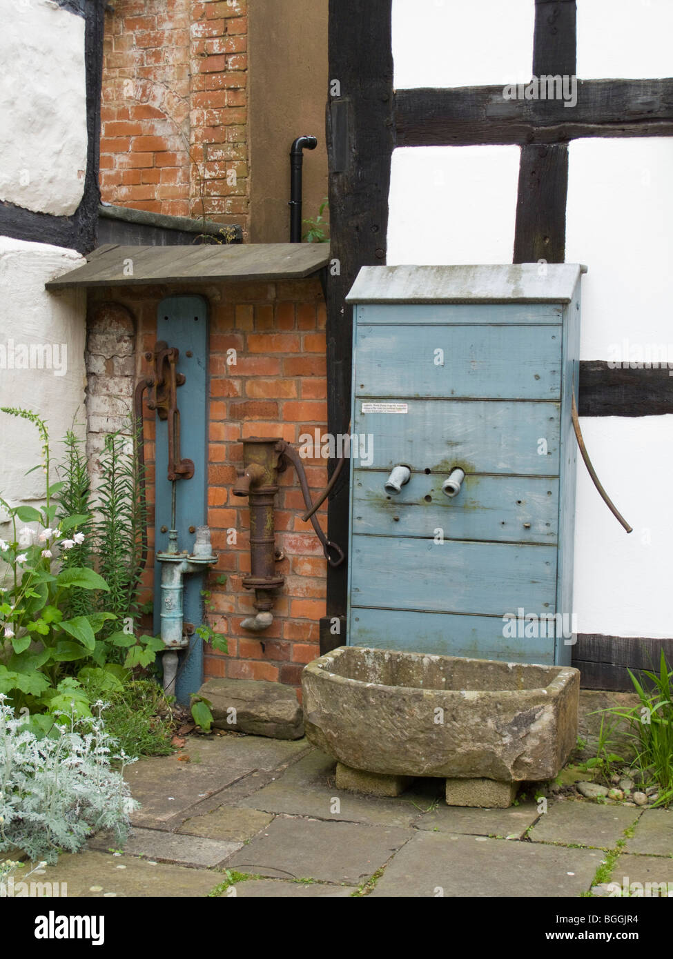 Ledbury Herefordshire UK Stone cistern and iron pump with faucet Stock ...