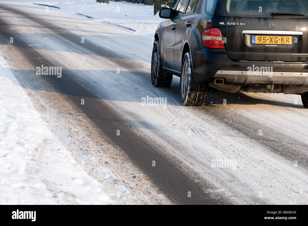 Car driving slowly street hi-res stock photography and images - Alamy