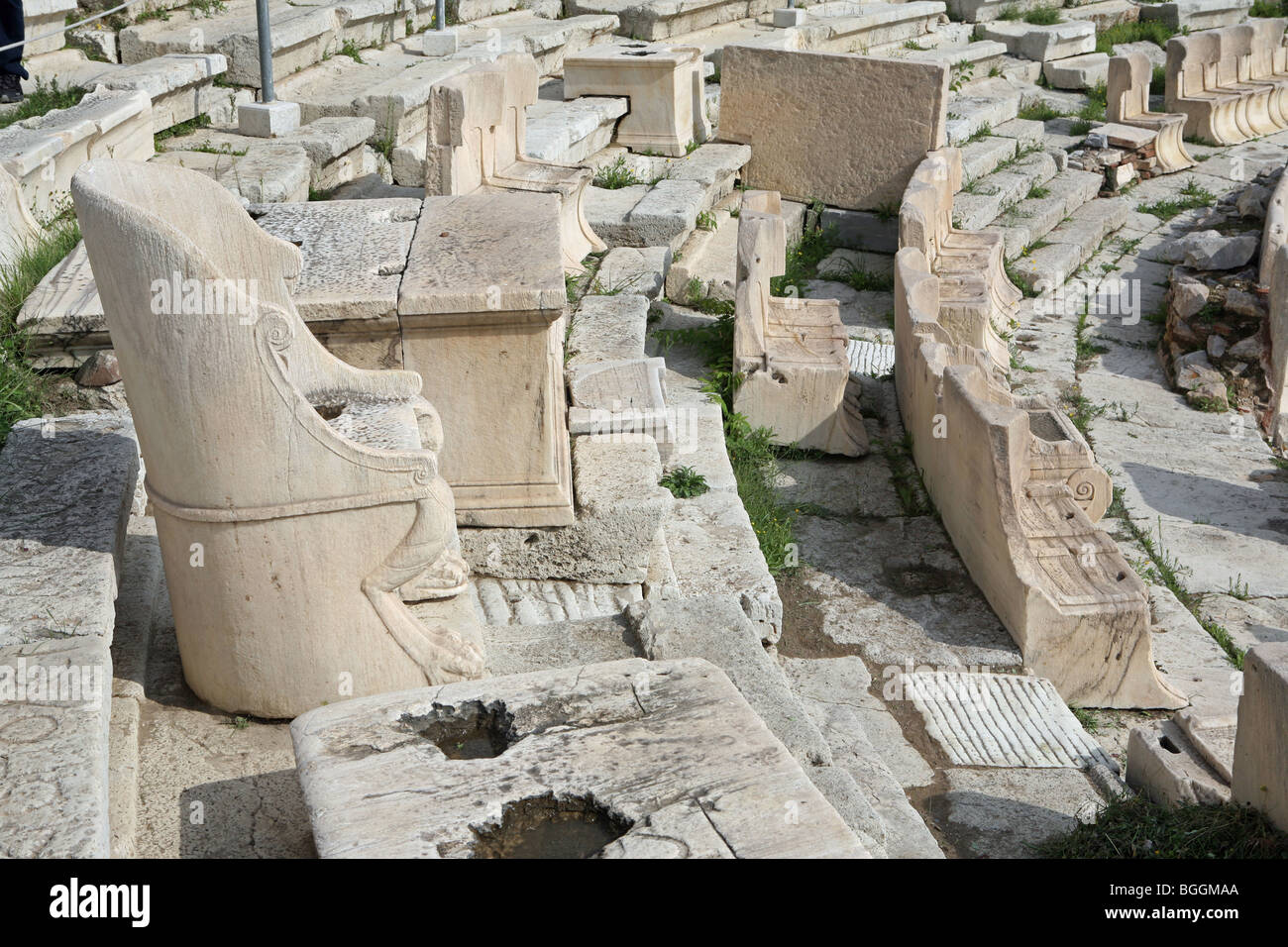 A stone carved seat at the theatre of Dionysos 342-326BC beside the ...