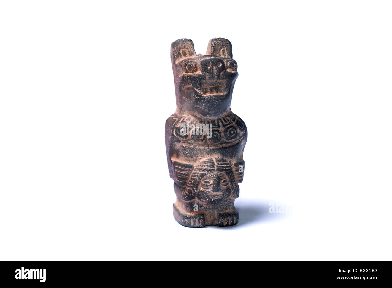 Peruvian animal deity statuette on white background Stock Photo - Alamy