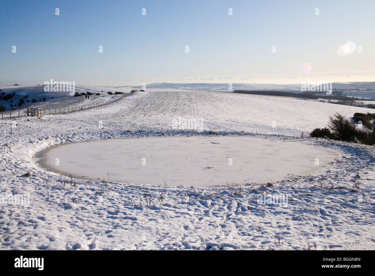 ditchling beacon and a frozen dew pond on the south downs Stock Photo ...