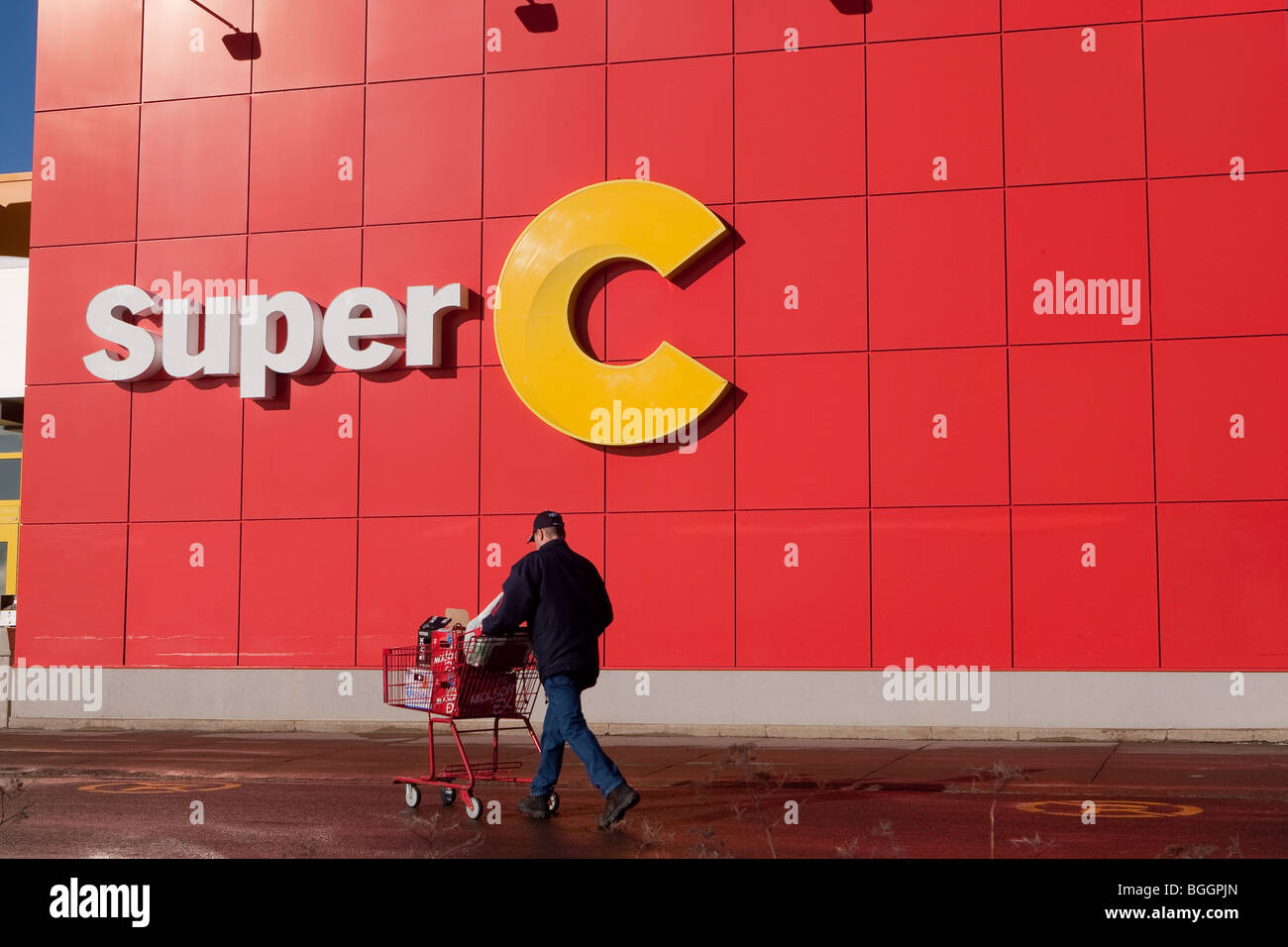 A client walks by a Super C grocery store Stock Photo - Alamy