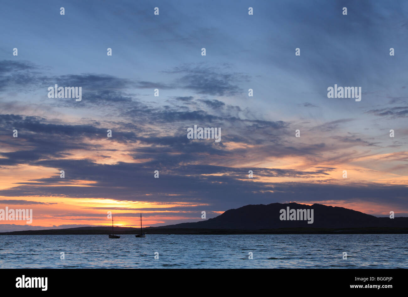 sailing boats in Carna at sunset, Connemara, Ireland Stock Photo - Alamy