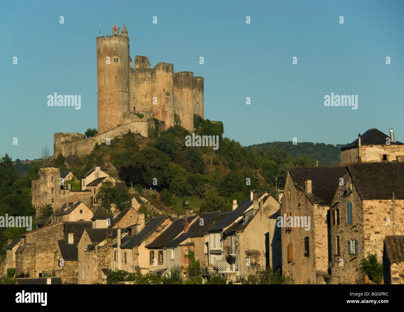 Castle above French village Stock Photo - Alamy