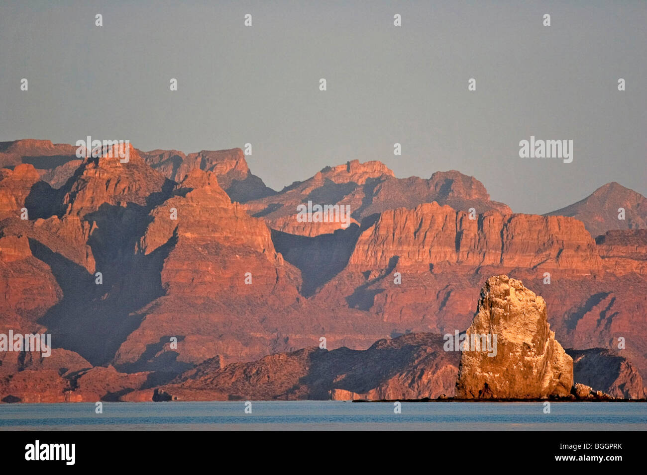 Sun shines on basalt rock, Baja California landscape, Sea of Cortez ...