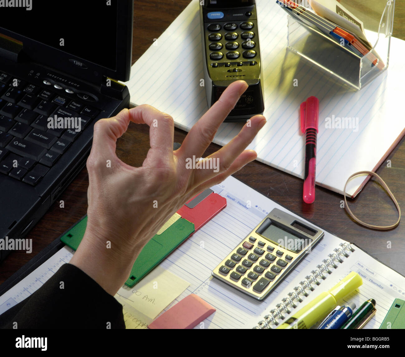 Office worker giving the ok or zero hand sign Stock Photo - Alamy