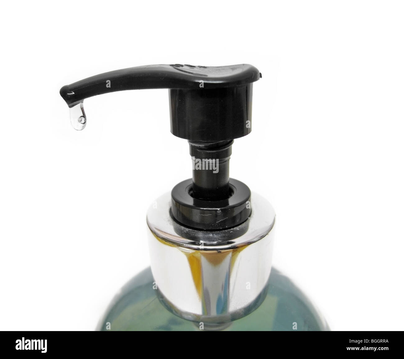 the top of a liquid soap dispenser showing a bubble of soap at the tip ...