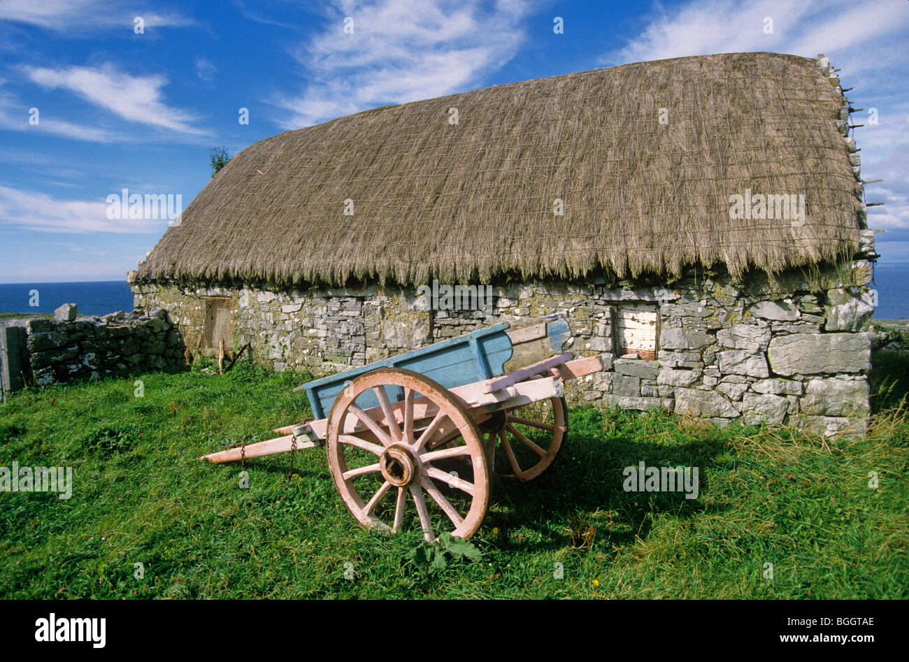 Cart and stone building on Inis Mor in the Aran Islands, County Galway ...