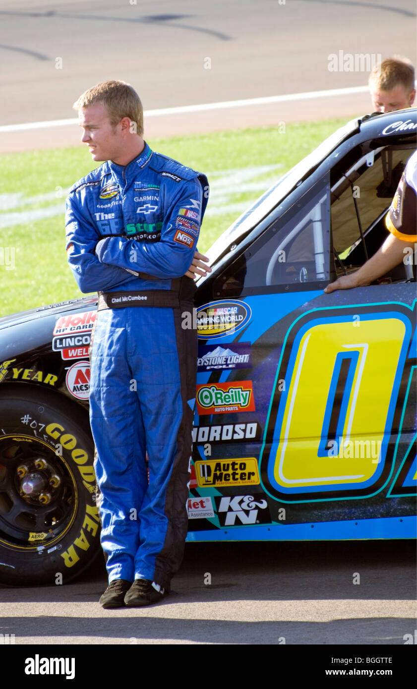 Chad McCumbee waits patiently by his Tiwi / Aerus number 7 Chevrolet ...