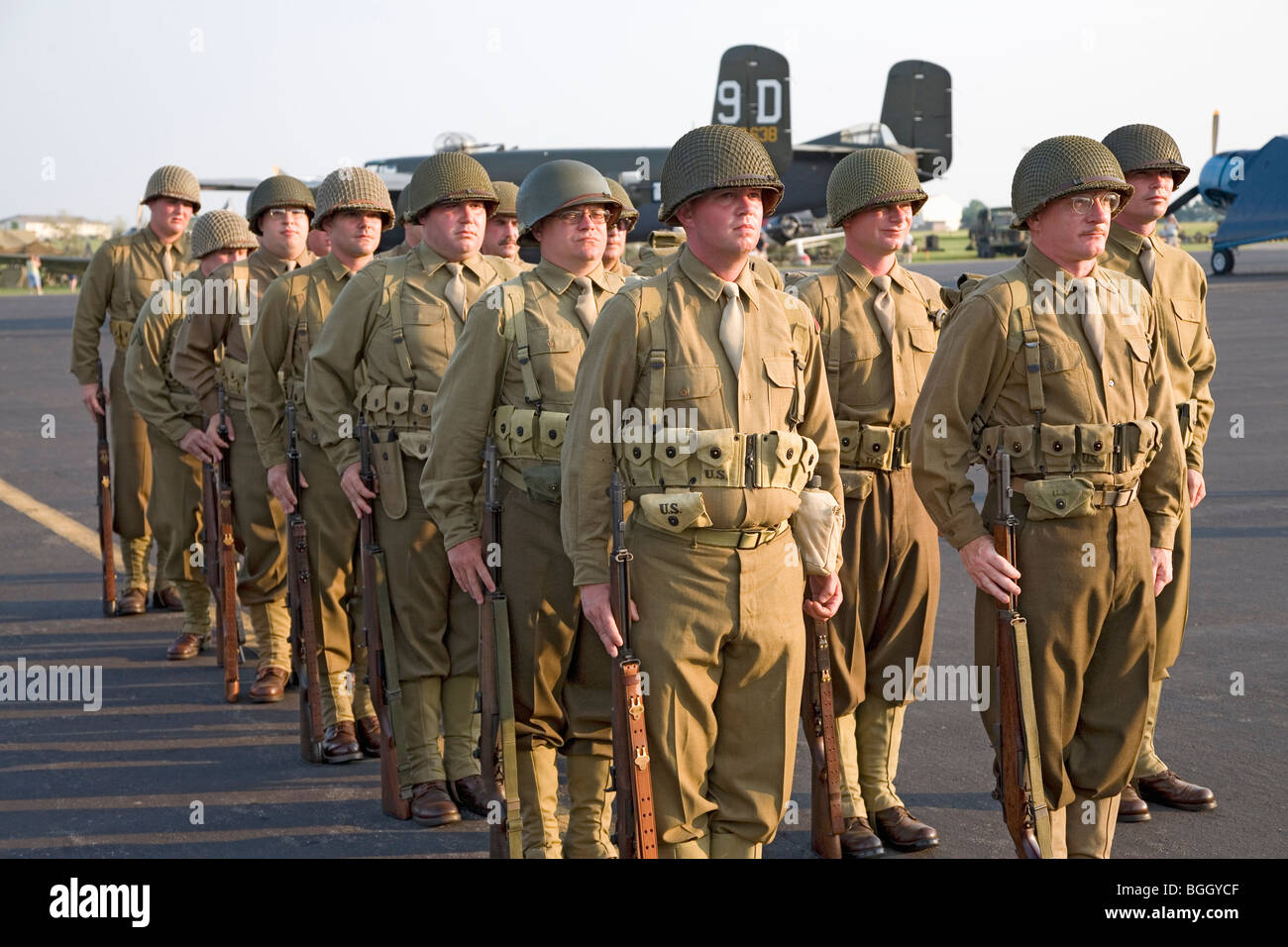 World War II Infantry troops standing at attention with sunset light on ...