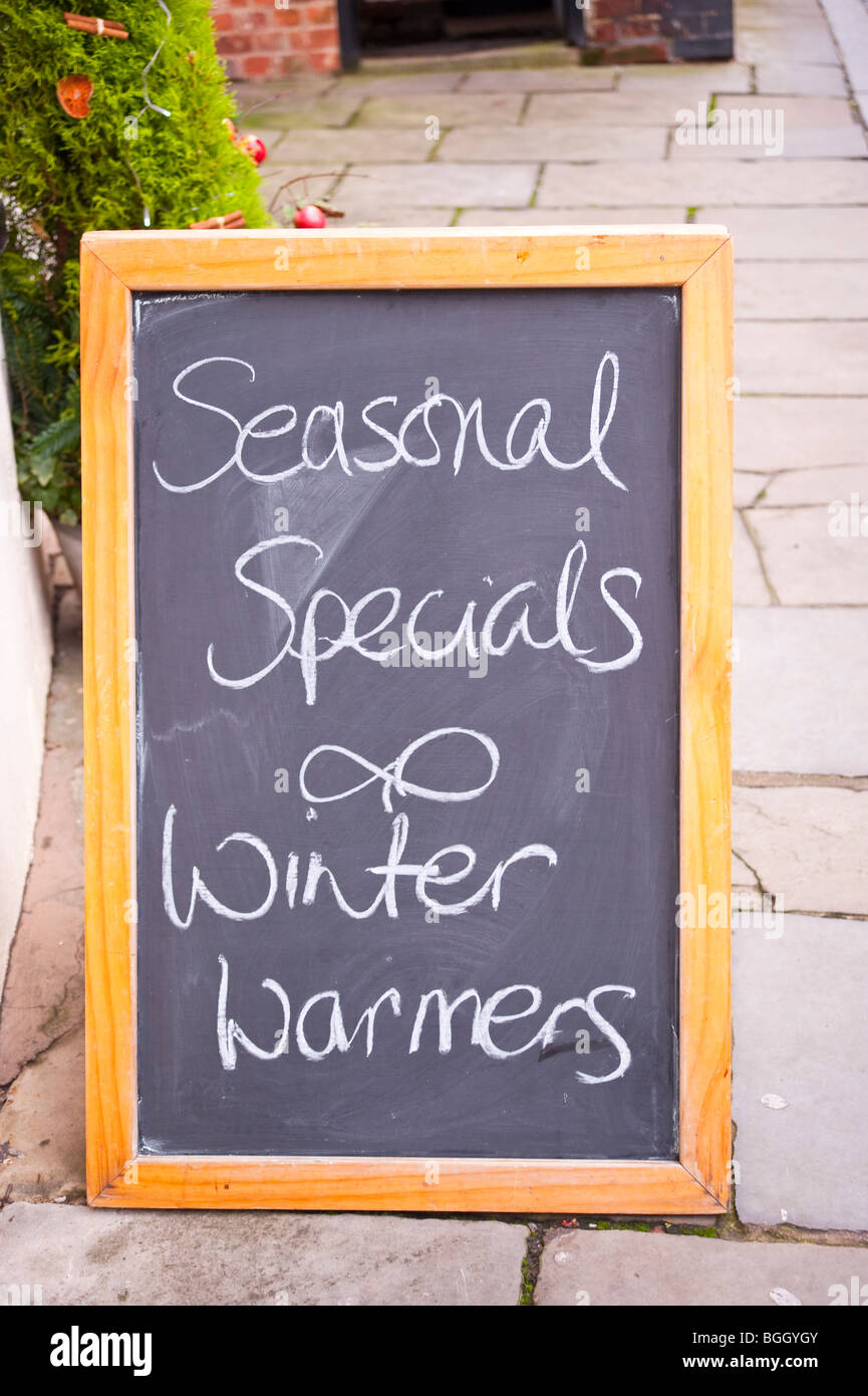 A sign advertising winter meals outside a Uk restaurant Stock Photo - Alamy