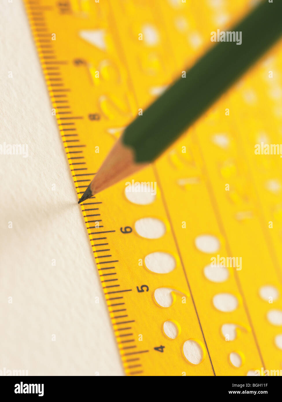 Pencil drawing a line with a ruler Stock Photo - Alamy
