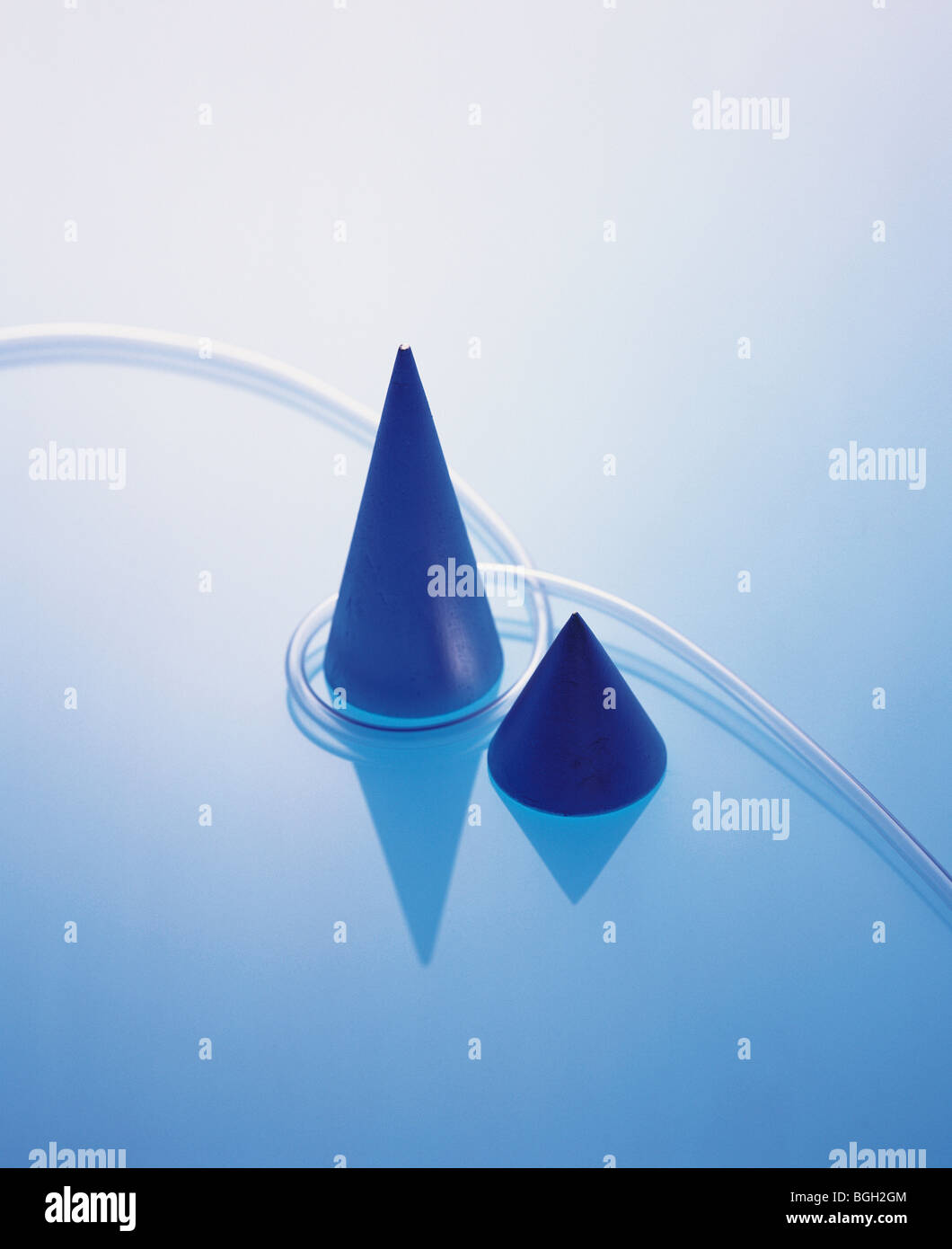 Cones and clear plastic pipe Stock Photo - Alamy