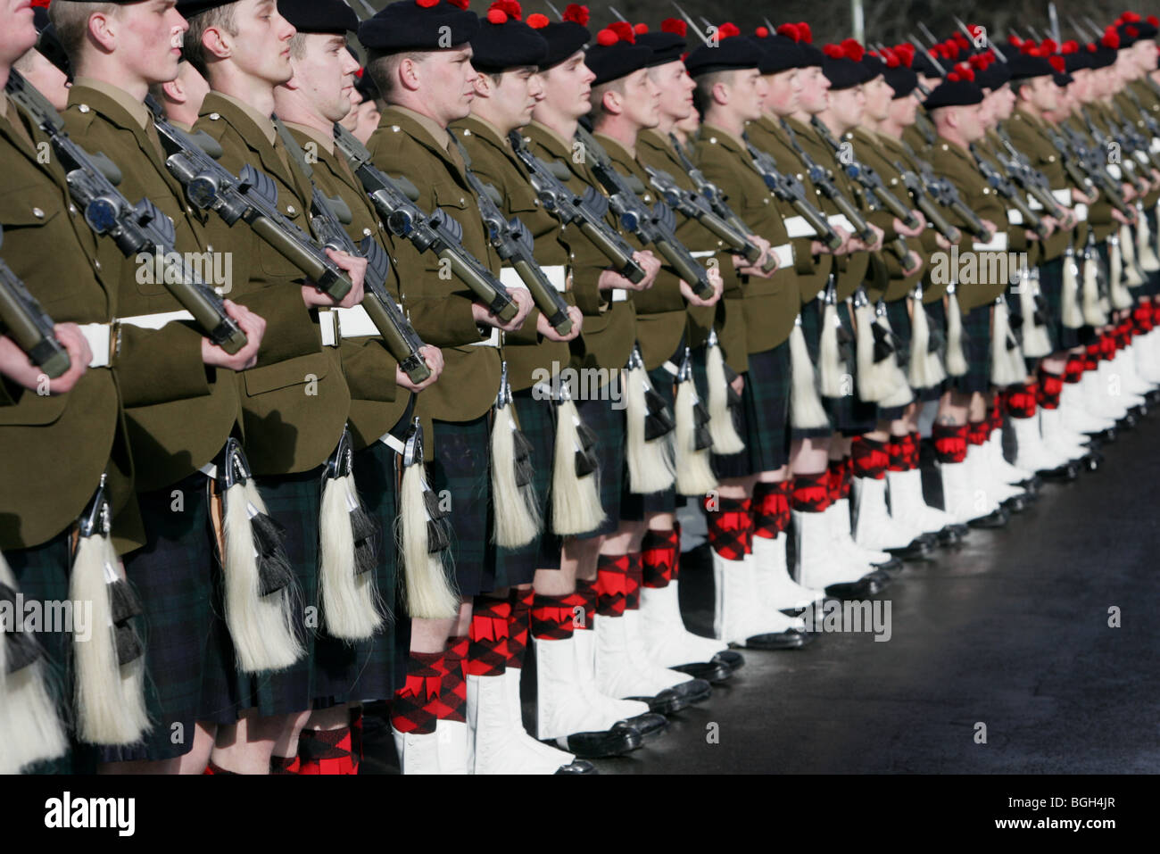 Scottish Blackwatch soldiers stand to attention in full parade uniform ...