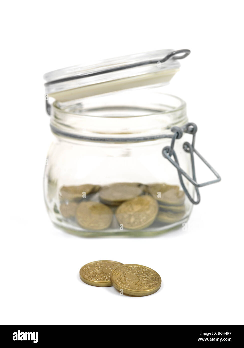 A glass jar used as a money box Stock Photo - Alamy