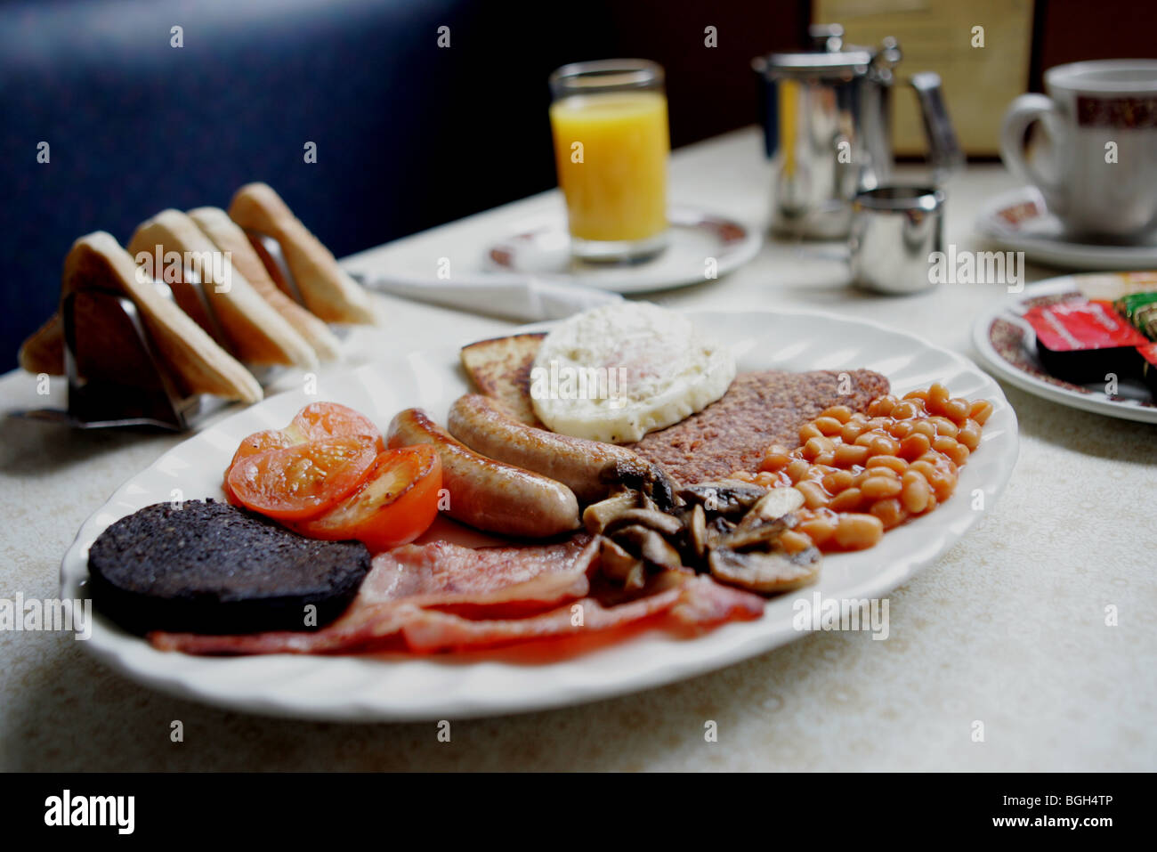 A traditional Scottish breakfast with tea, toast and orange juice Stock ...