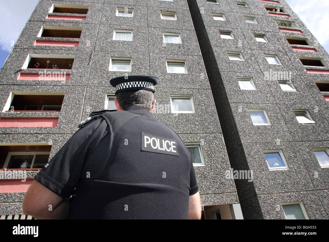 A Scottish police officer in front of a high rise block of flats Stock ...