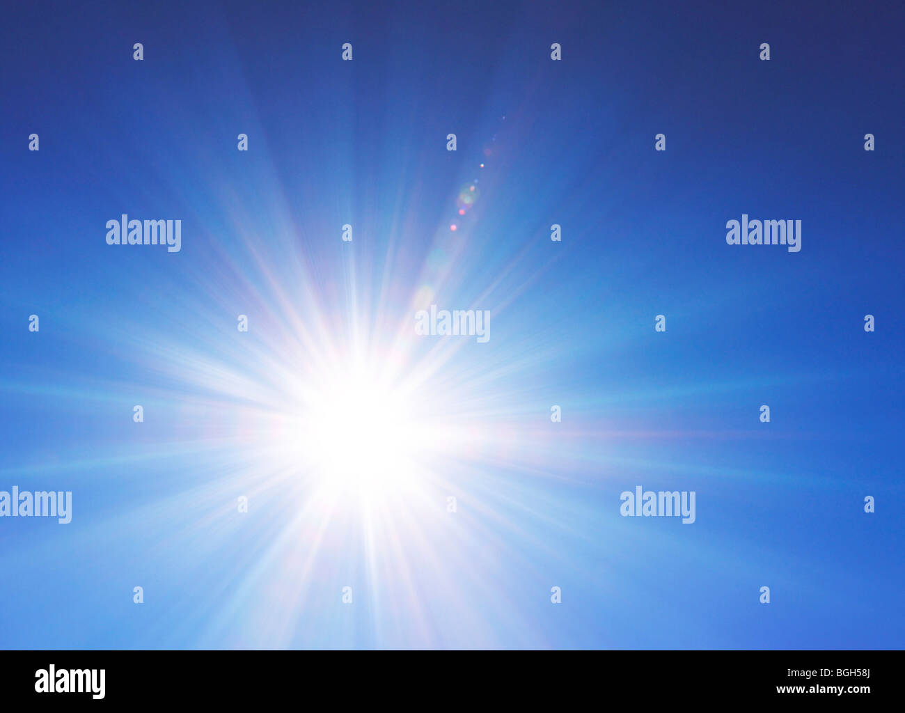 Sun in a blue sky Stock Photo - Alamy