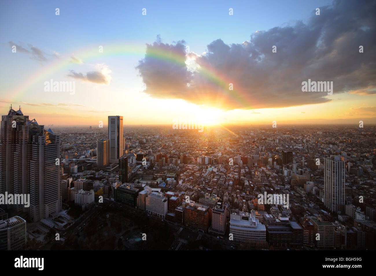 The setting sun and a rainbow over East Tokyo from the Tokyo ...