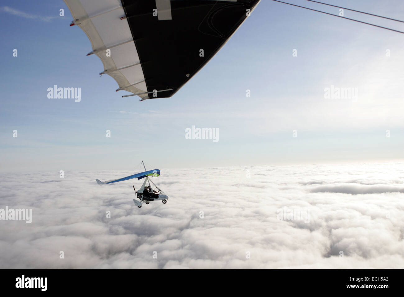 Microlight flight as seen from another Microlight above the clouds ...