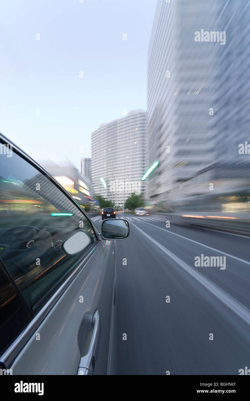 Car driving through the city Stock Photo - Alamy
