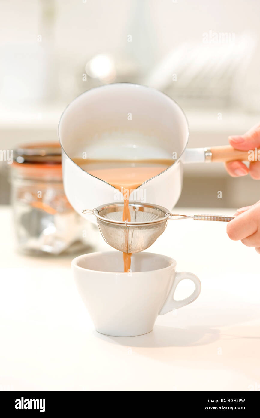 Pouring chai tea Stock Photo - Alamy