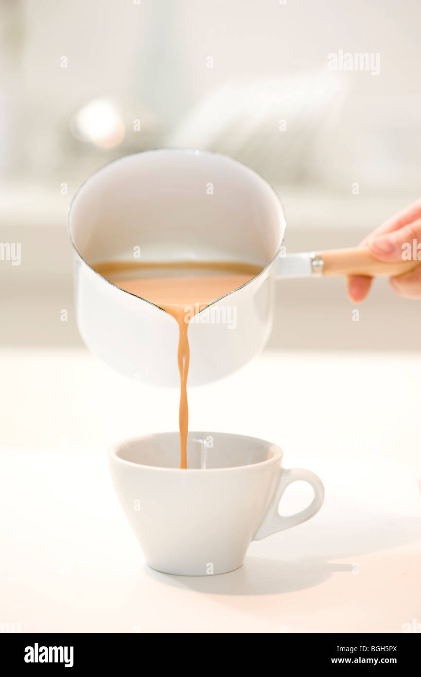 Pouring chai tea Stock Photo - Alamy