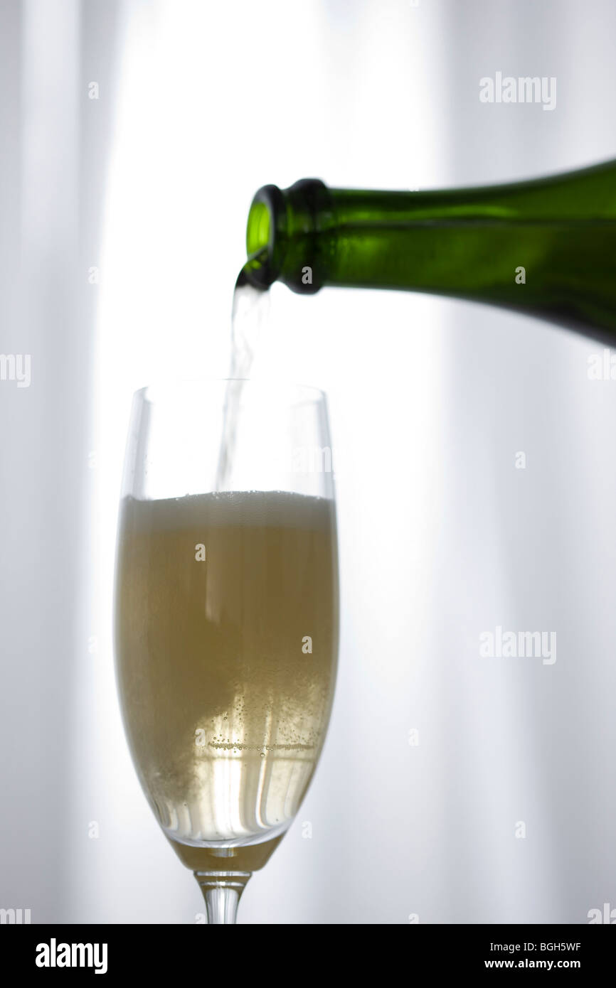 Pouring champagne inside flute glass hi-res stock photography and ...