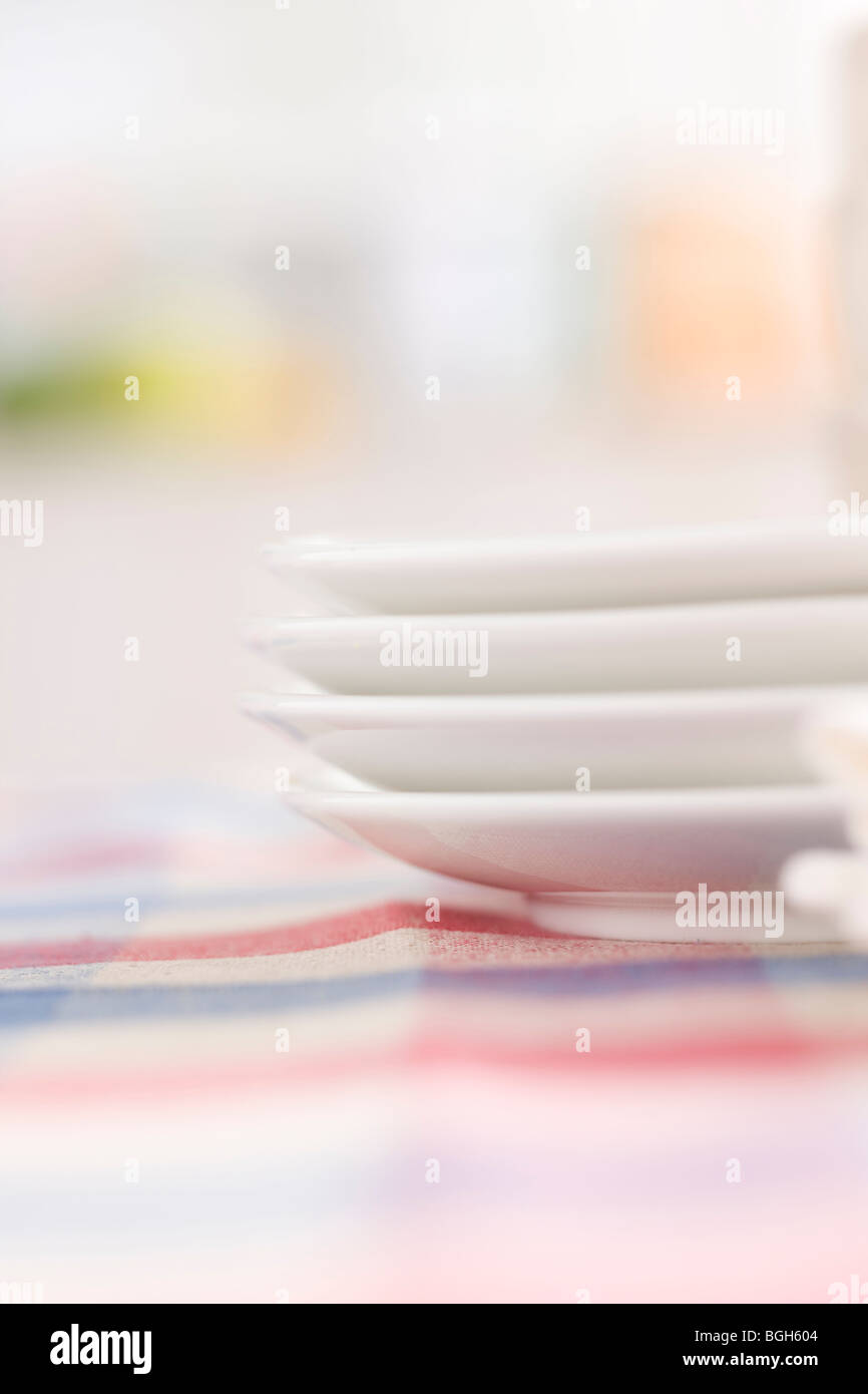 Stack of dishes on a table Stock Photo - Alamy