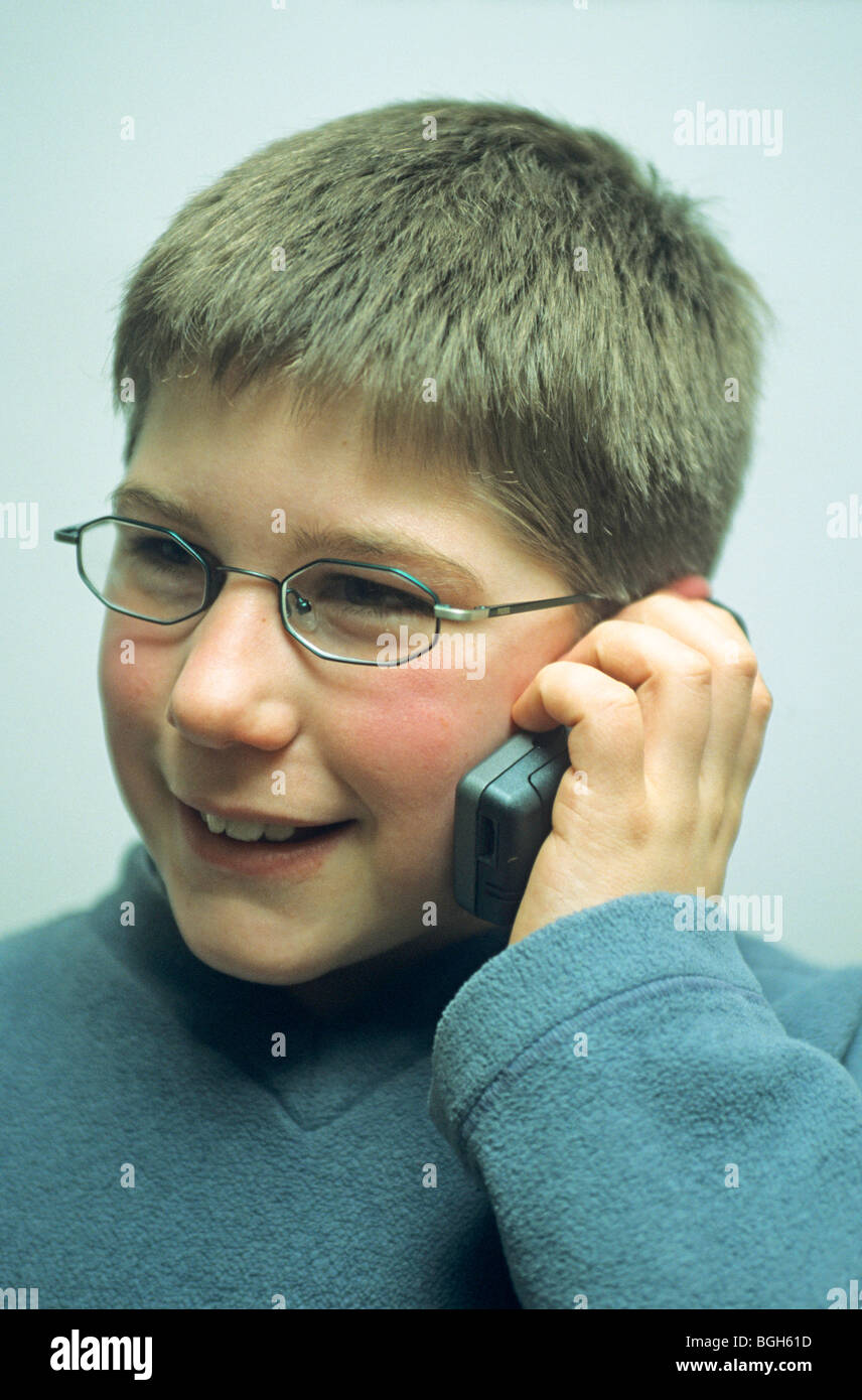 portrait of a young boy using his mobile phone Stock Photo - Alamy