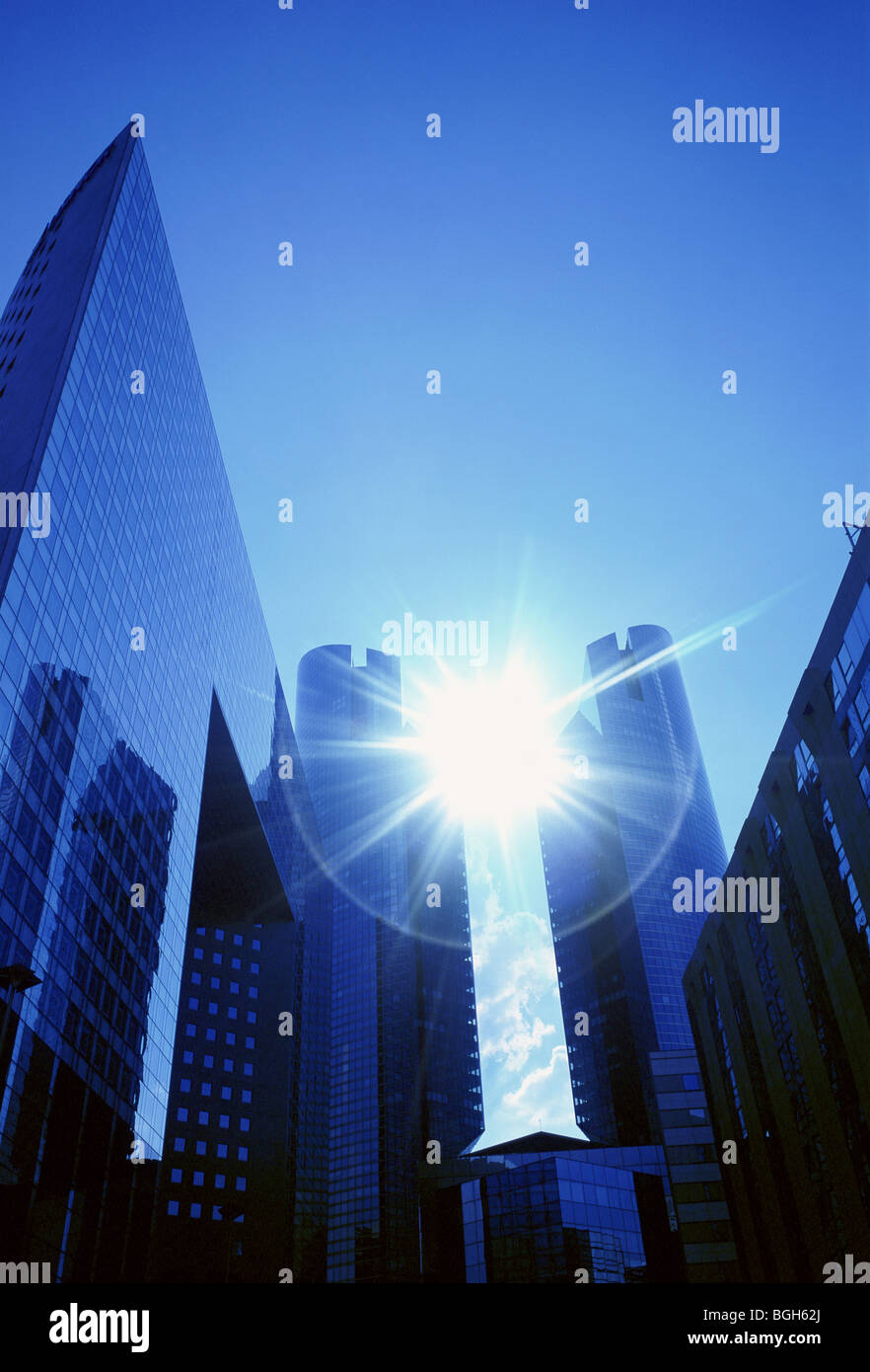 Sun shining through skyscrapers Stock Photo - Alamy
