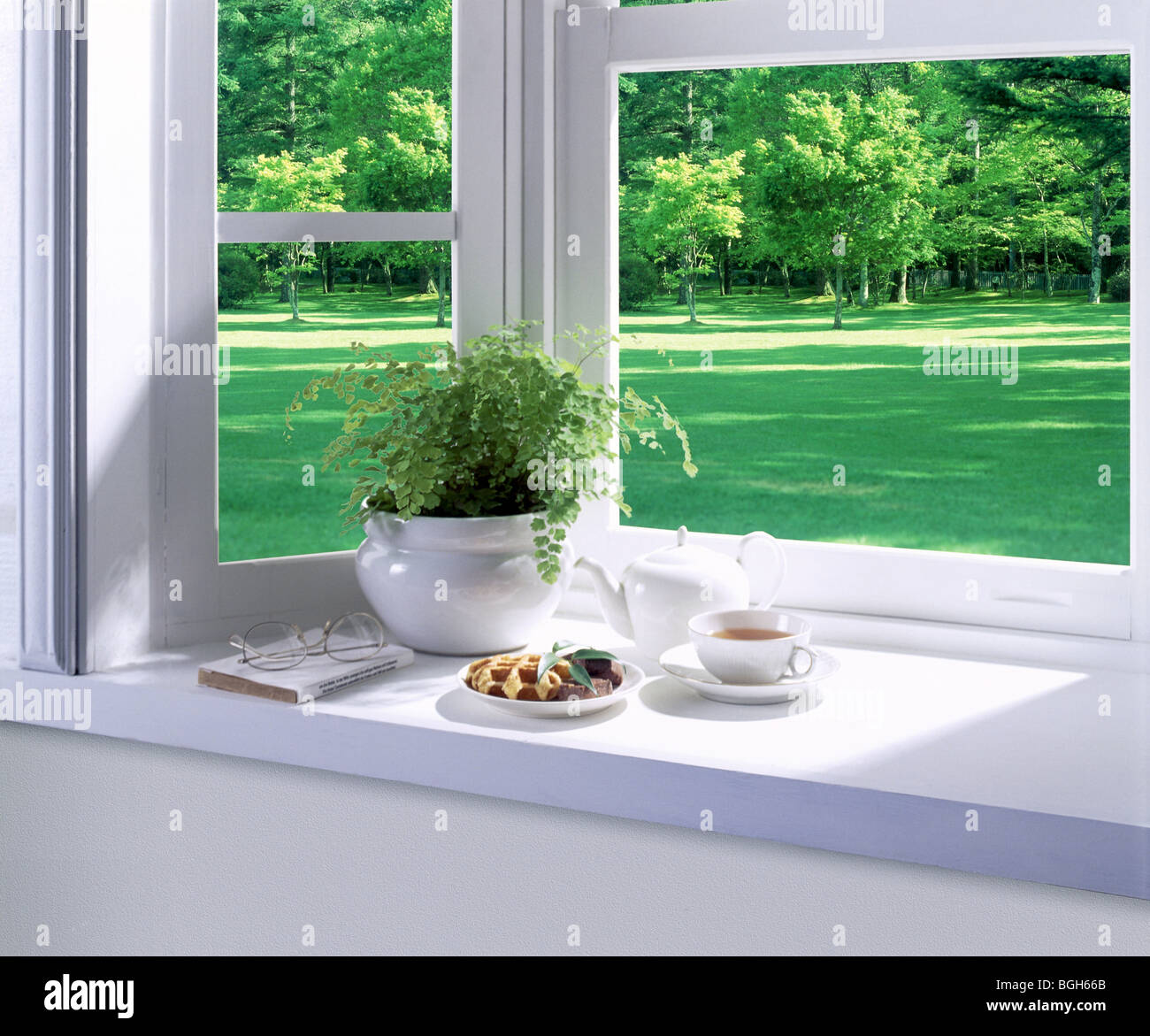 Bay window with afternoon tea and a potted plant Stock Photo - Alamy